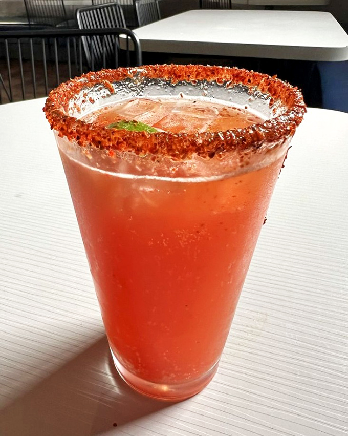 This isn't just a cocktail – it's a spicy statement piece with a chili salt rim that dares you to take that first sip. Liquid courage, indeed.
