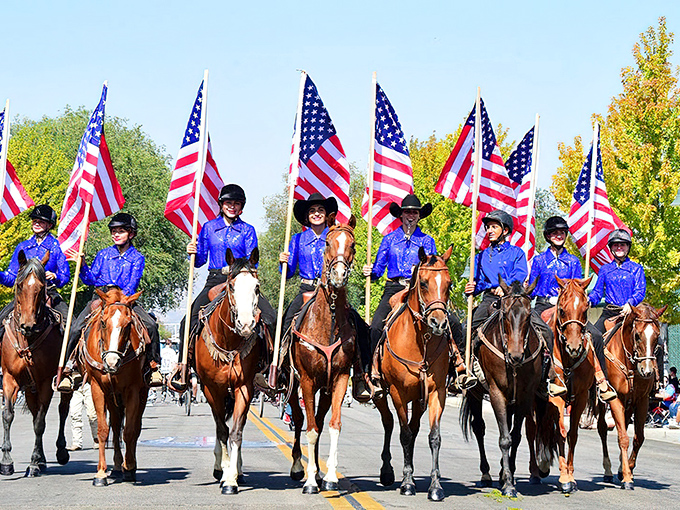 The Mountain Festival parade combines horses, flags, and community pride in a display that would make Norman Rockwell reach for his paintbrush.