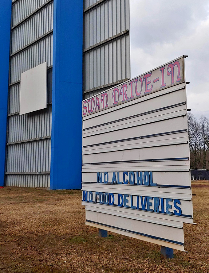 House rules spelled out in blue and white&mdash;a gentle reminder that some traditions, like enjoying movies without alcohol, never go out of style.