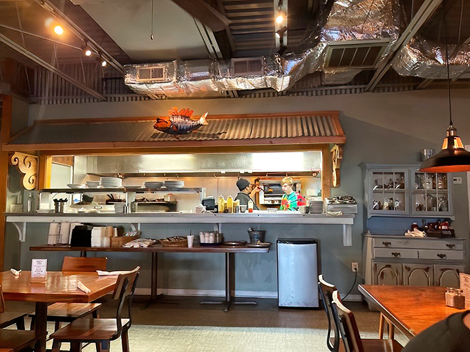 The open kitchen isn't just for show&mdash;it's a stage where seafood becomes the star. That corrugated metal awning adds just the right touch of coastal charm.