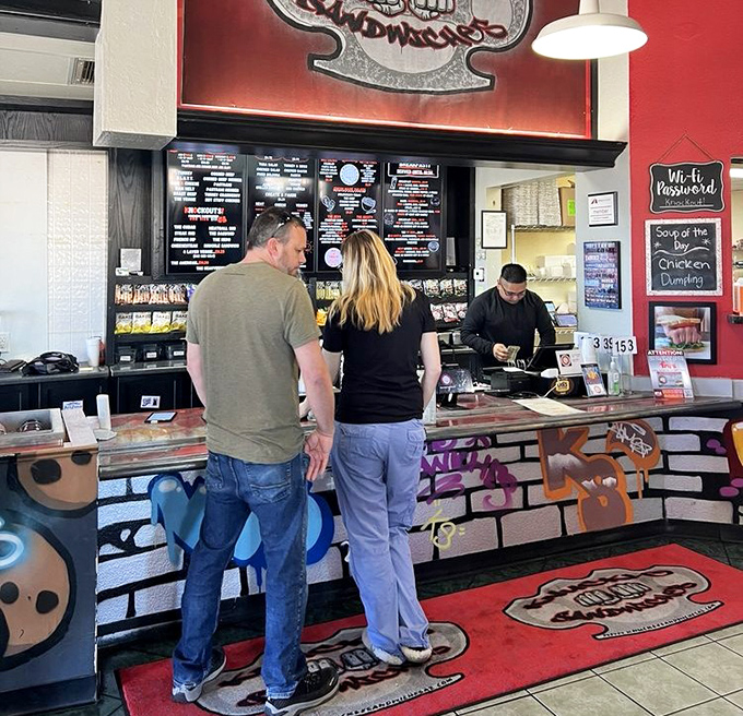 The moment of decision at the counter&mdash;where friendly staff stand ready to transform your hunger into happiness with boxing-themed culinary creations.