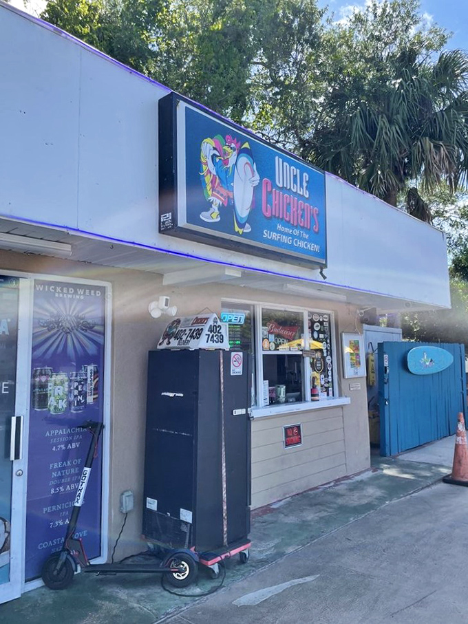 The iconic Uncle Chicken's sign promises "Surfing Chicken" – because in Florida, even the poultry knows how to hang ten beneath swaying palms.