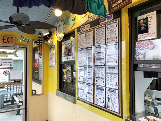 Behind this cheerful ordering window, magic happens one perfectly crafted meal at a time daily.