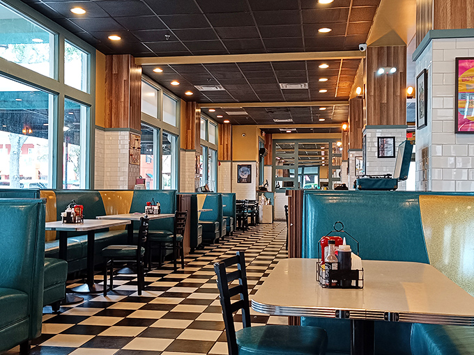 The classic black and white checkered floor leads you through a diner experience that feels both nostalgic and completely fresh.