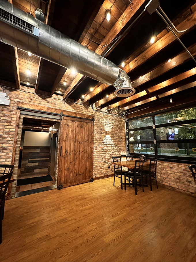 Exposed wooden beams and industrial ductwork create a space that feels both rustic and refined &ndash; the perfect backdrop for serious barbecue contemplation.