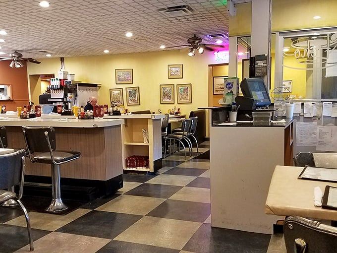 Yellow walls, ceiling fans, and cozy booths&mdash;the diner trifecta. This isn't interior design; it's a time machine to when conversations happened without screens.