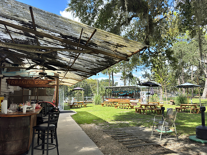 Outdoor seating where the air is flavored with river breeze and the distant promise of someone catching dinner.