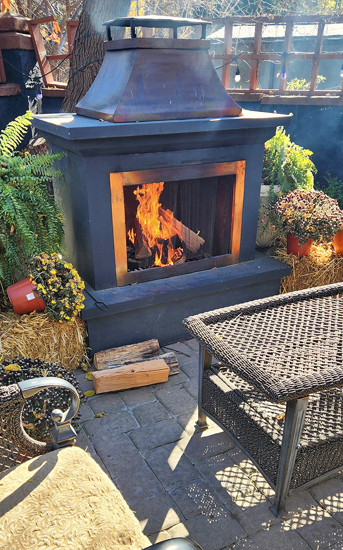 This isn't just an outdoor fireplace; it's a window into the primal connection between fire, food, and fellowship that makes barbecue more than just a meal.