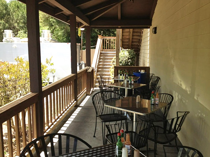 The outdoor patio offers a serene escape with simple tables and chairs. Sometimes great food tastes even better in fresh air.