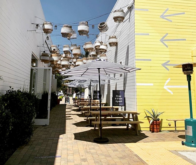 Outdoor dining under string lights with buoy decorations overhead&mdash;because seafood always tastes better when there's a hint of salt in the air and sun on your shoulders.