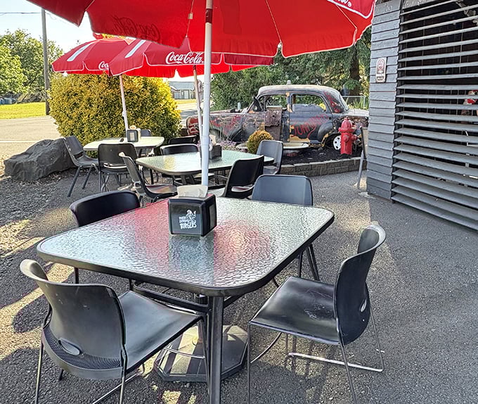 Outdoor dining with a side of automotive history &ndash; that vintage car isn't just decoration, it's part of the Junkyard's soul.