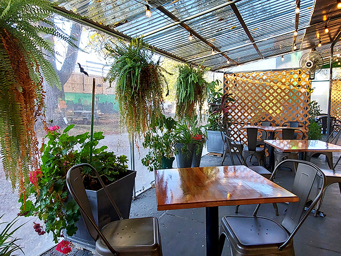 Nature meets nurture in this plant-filled patio oasis. Hanging ferns create a secret garden vibe that makes every bite taste even better.
