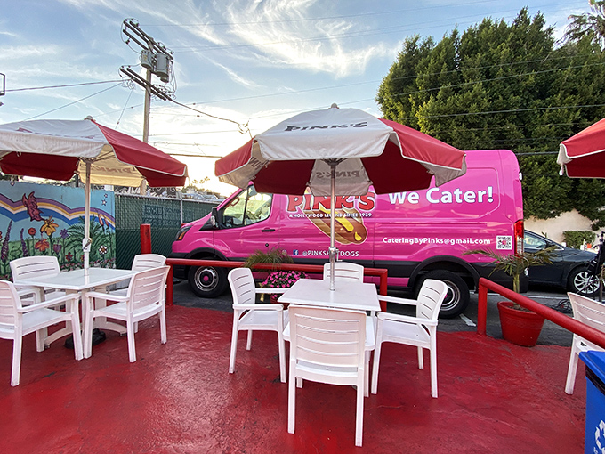 Pink's outdoor seating area offers the quintessential LA dining experience: sunshine, people-watching, and the constant threat of dripping chili.
