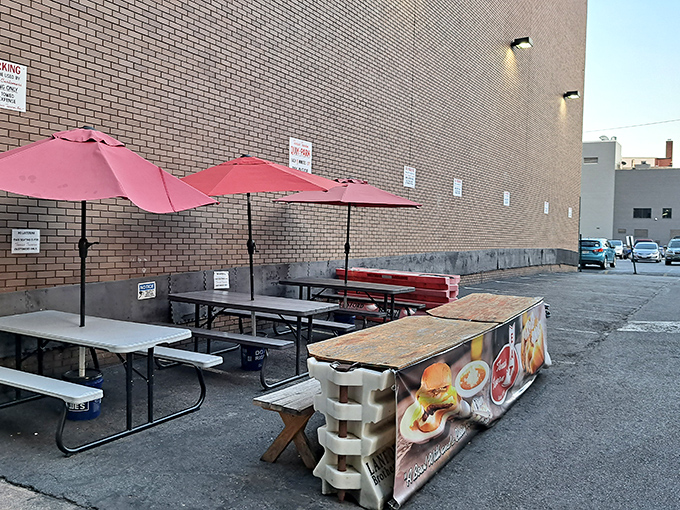 No fancy patio furniture here—just honest outdoor seating where the people-watching rivals any Netflix series.