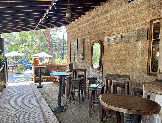 The covered patio offers a blend of indoor comfort and outdoor freshness, with tables spaced for conversation not eavesdropping.
