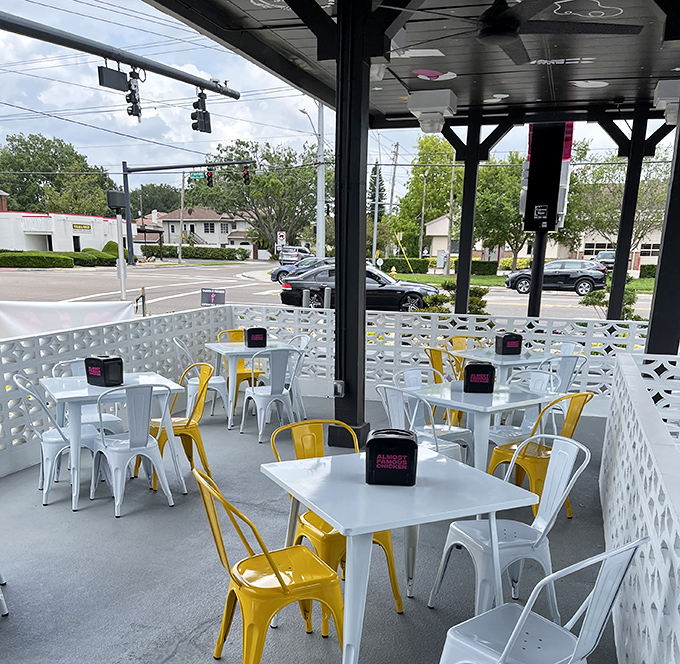 Outdoor seating with pops of sunshine yellow. Florida dining as it should be&mdash;breezy, bright, and ready for chicken-induced euphoria.
