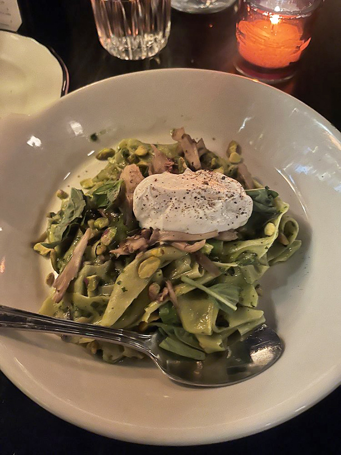 Pasta that doesn't just sit on the plate but seems to dance with mushrooms and a poached egg in perfect culinary choreography.