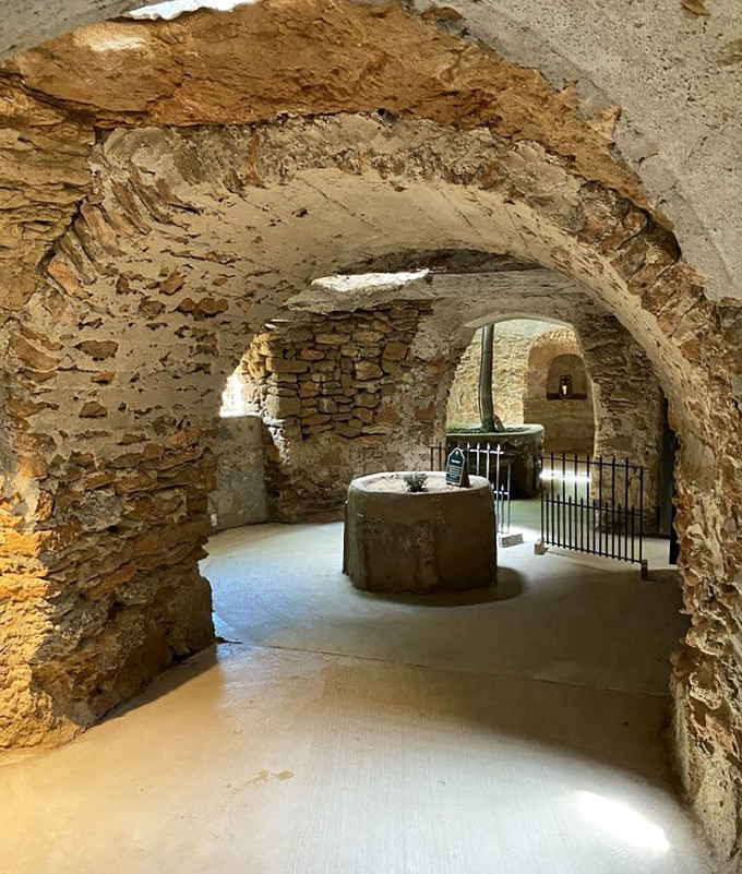 Arched passageways connect living spaces with artistic flair. Who needs hallways when you can have underground Roman-inspired corridors?