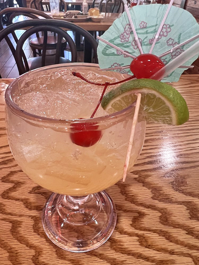 A cocktail dressed up for a special occasion, complete with the tiny paper umbrella that somehow makes everything taste better.