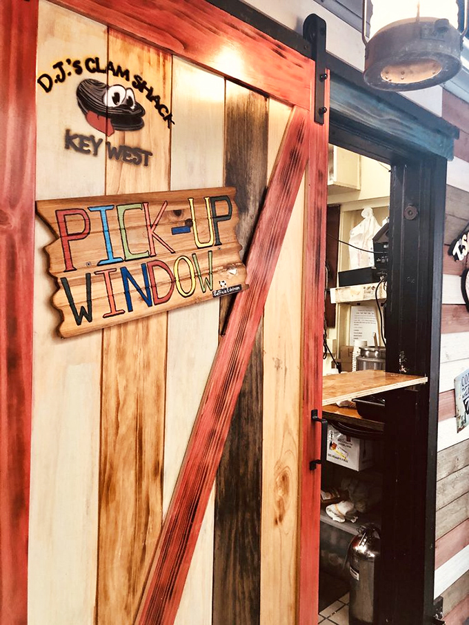 The "Pick-Up Window" sign has the rustic charm of driftwood—appropriate for a place that treats seafood with the reverence it deserves.
