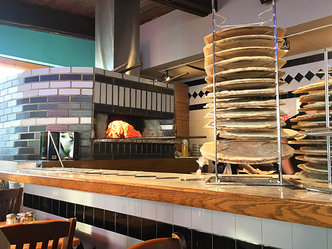 The wood-fired oven &ndash; the beating heart of Faccia Luna &ndash; where dough transforms into pizza magic before your very eyes.