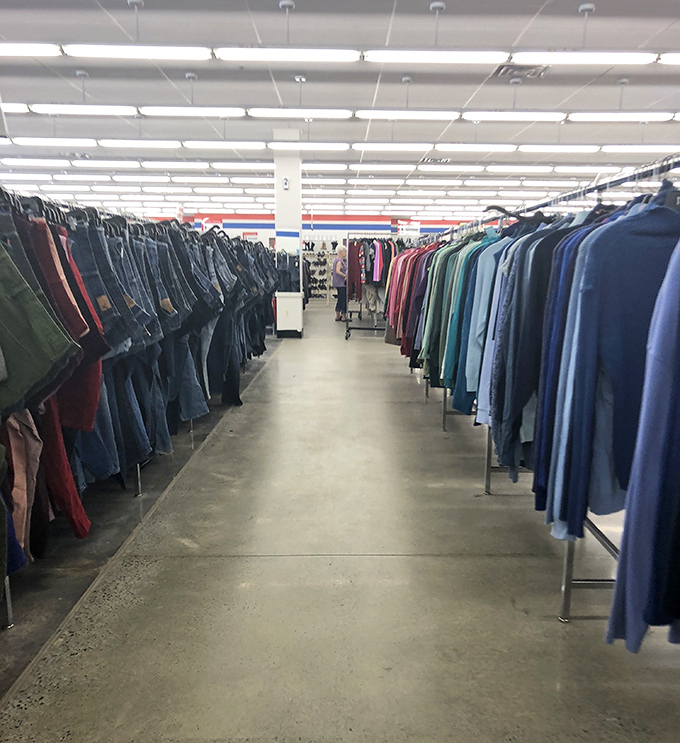 Clothing racks stretching toward the horizon &ndash; a textile landscape where patience rewards the dedicated treasure hunter.