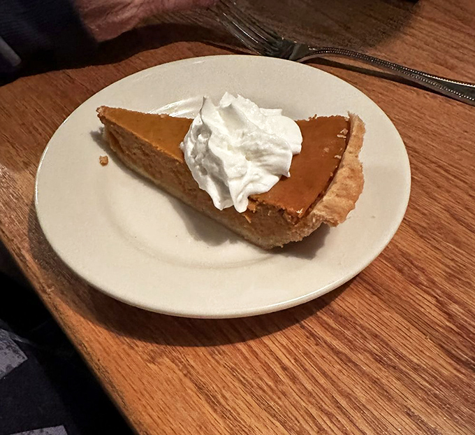 A slice of pumpkin pie that doesn't need to be seasonal to be spectacular&mdash;especially with that cloud of whipped cream on top.