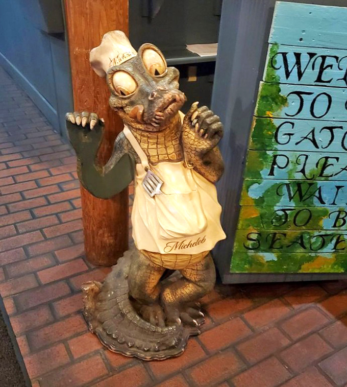 Meet the restaurant's unofficial greeter&mdash;a chef gator statue who's been witnessing first dates, family celebrations, and wing cravings for years.