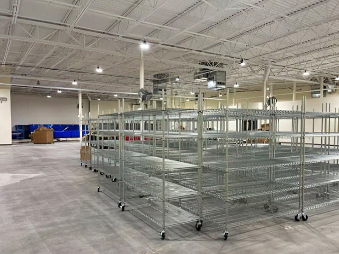 The calm before the shopping storm&mdash;empty metal racks waiting to be filled with tomorrow's treasures. Like a blank canvas for the art of thrift.