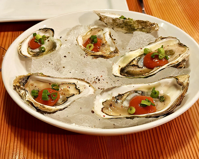 Fresh oysters on ice &ndash; nature's perfect appetizer dressed with just enough garnish to enhance without overwhelming their briny brilliance.