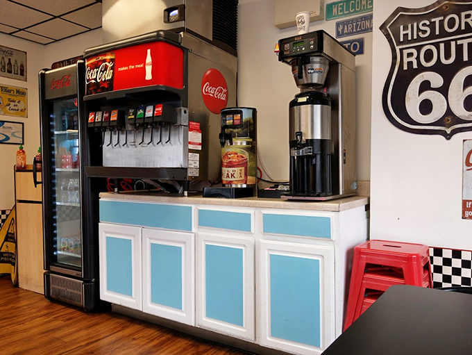 That classic Coca-Cola machine stands ready to dispense the perfect companion to your burger feast&mdash;some traditions never need updating.