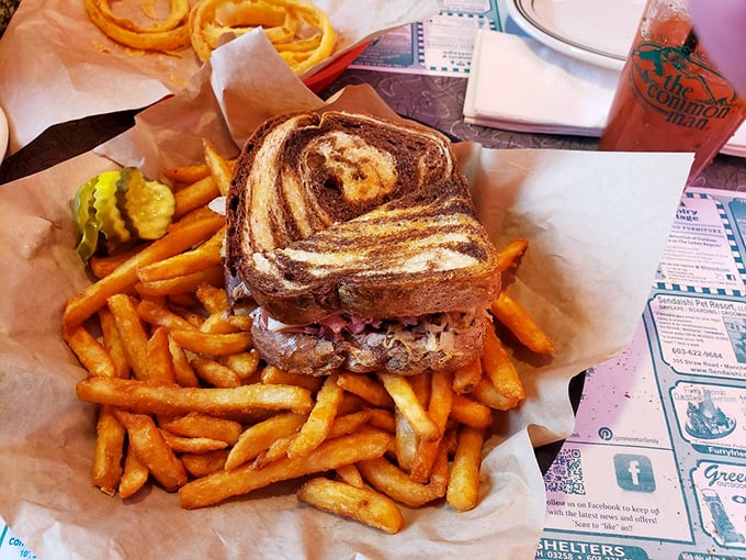 Sandwich architecture at its finest&mdash;grilled marble rye supporting the perfect balance of meat, cheese, and fries that deserve their own spotlight.