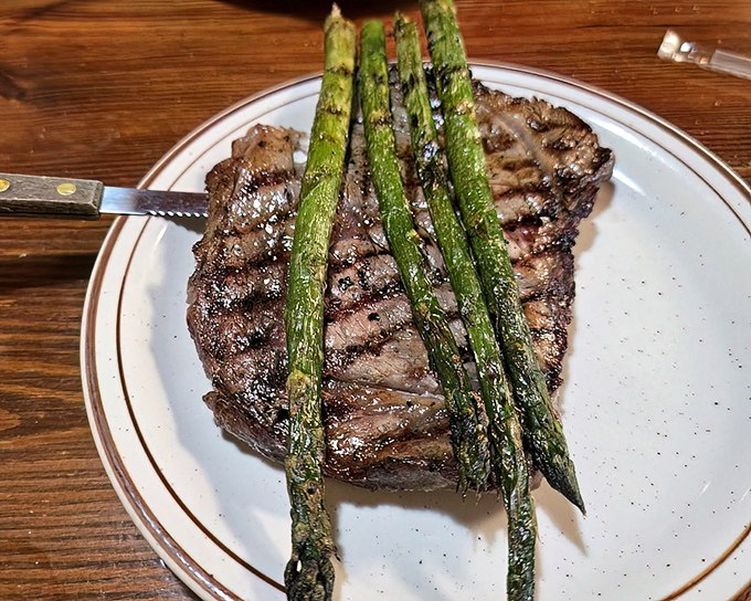 This ribeye with grilled asparagus isn't just dinner&mdash;it's proof that sometimes the simplest combinations are culinary poetry on a plate.