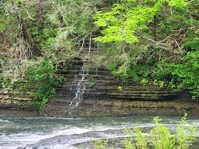 The gentle cascades upstream offer a soothing prelude to the main event &ndash; nature's version of an opening act that deserves its own spotlight.