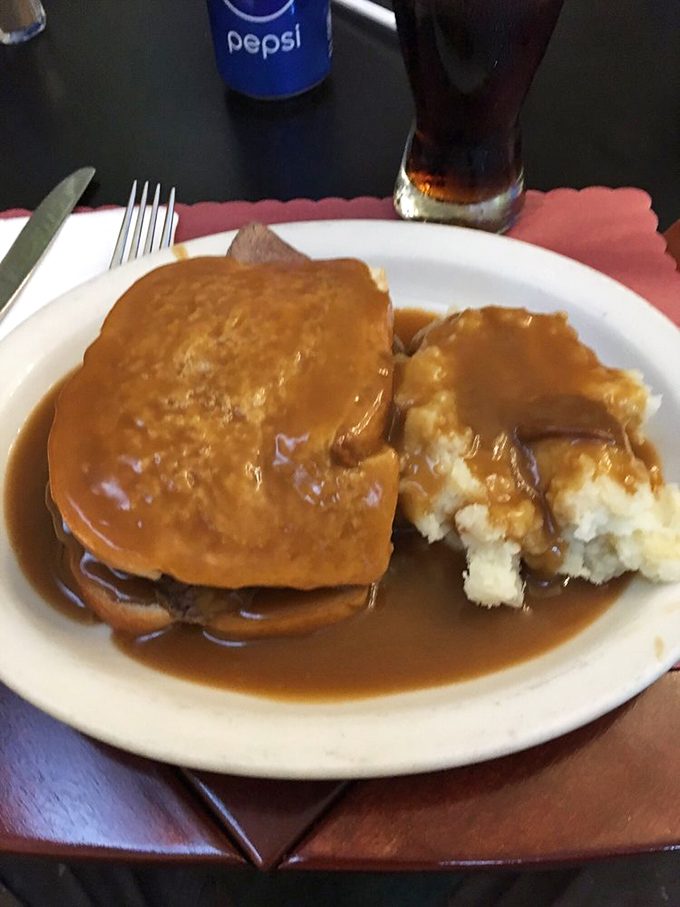 This roast beef sandwich drowning in gravy represents everything right about American comfort food done with genuine care.