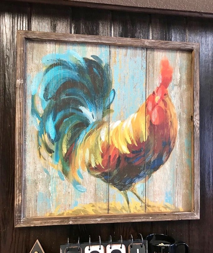 A colorful rooster painting watches over diners&mdash;the unofficial mascot and silent judge of whether you've properly cleaned your plate.