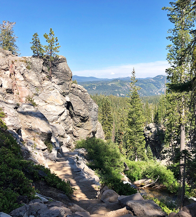 The trail offers occasional glimpses of the surrounding landscape, reminding you that sometimes the journey rivals the destination.