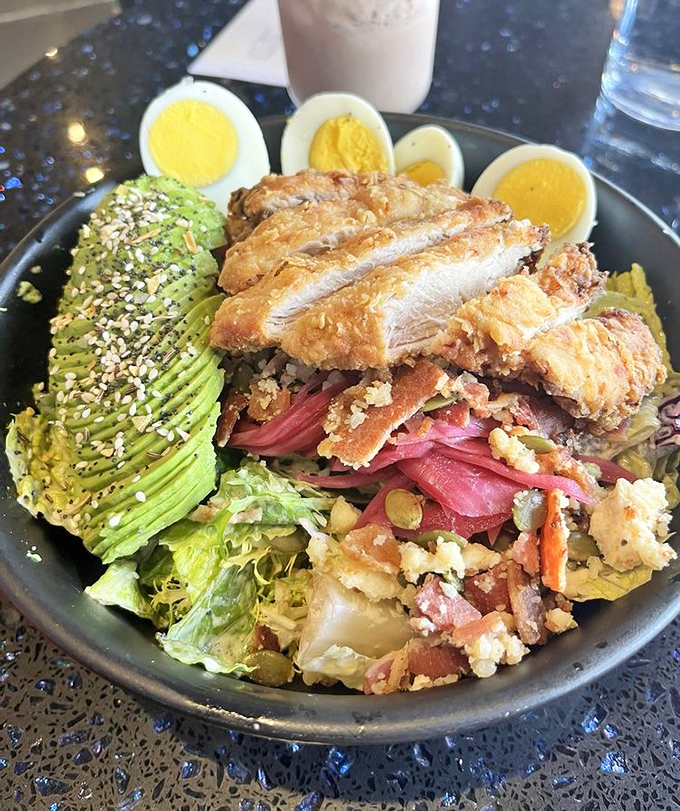This isn't just a salad&mdash;it's a celebration. Crispy chicken, avocado, and hard-boiled eggs having the garden party of the century.