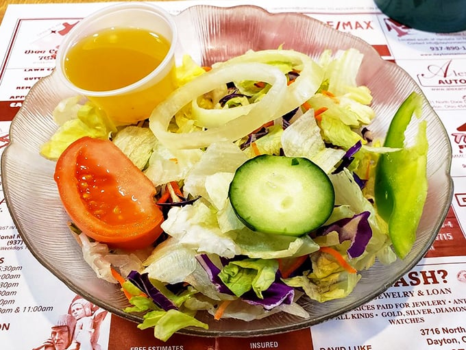 The side salad that politely suggests "maybe eat something green" while knowing full well you're here for the other stuff.