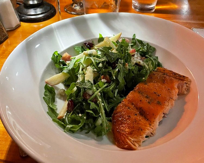 A perfectly seared salmon alongside greens so fresh they might have been harvested during your drive to the restaurant.