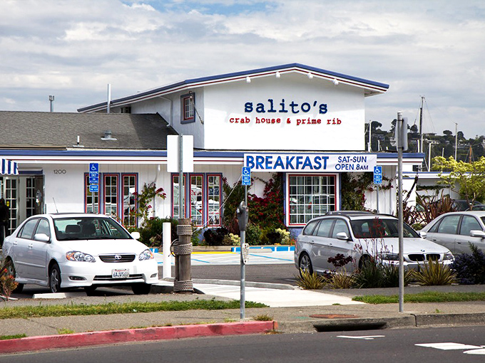 Salito's Crab House beckons with its cheerful blue and white exterior, promising breakfast with a side of maritime charm seven days a week.