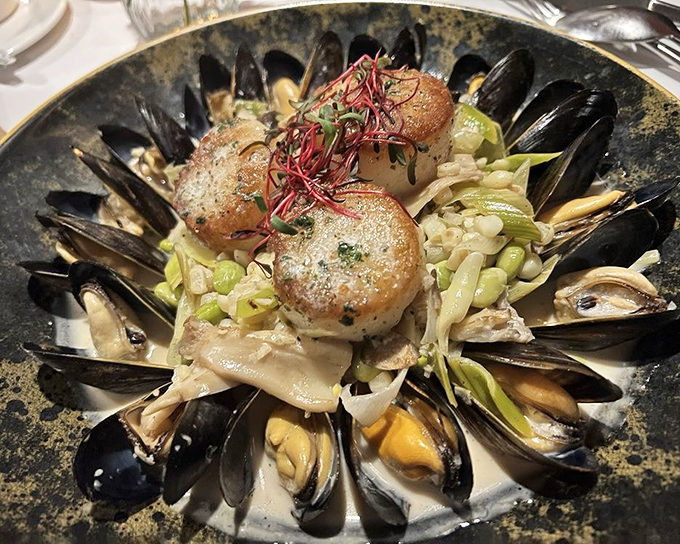 Perfectly seared scallops crown a throne of mussels – seafood royalty that proves landlocked Pennsylvania can rival coastal restaurants for oceanic treasures.