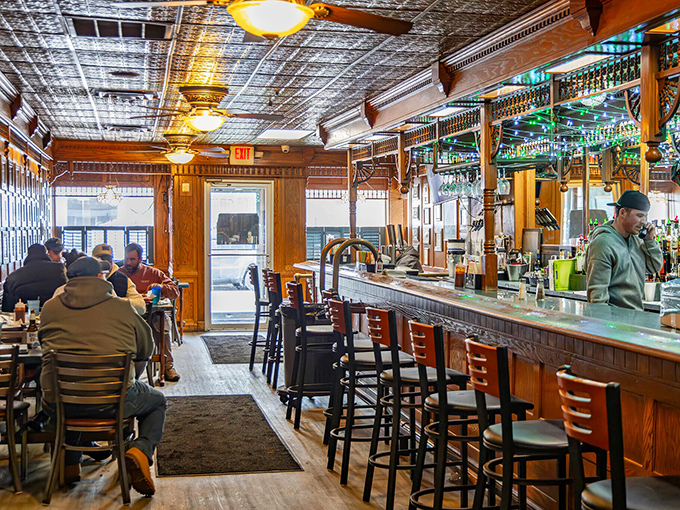 Inside the Scioto Ribber, warm wood paneling and a classic bar create the unpretentious atmosphere where locals gather for conversation as satisfying as the food.