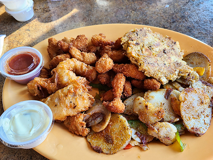This seafood platter doesn't just satisfy hunger&mdash;it conquers it. Golden-fried treasures with dipping sauces that make taste buds stand at attention.
