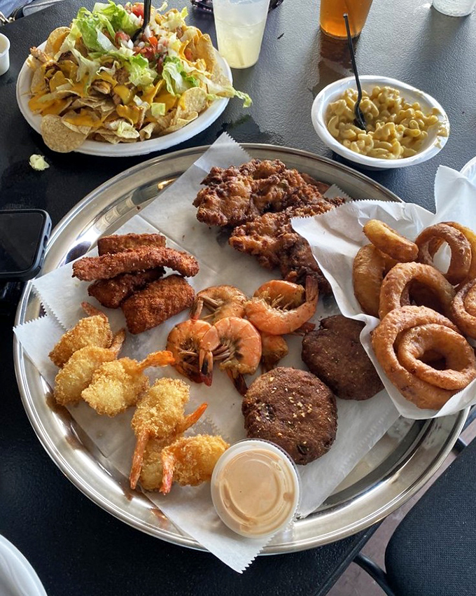 The seafood sampler platter showcases the ocean's greatest hits, from golden shrimp to crispy fish in one glorious feast.