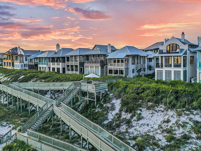 Sunset paints these coastal homes in golden light, while boardwalks protect the dunes below. Beach living with environmental consciousness built in.