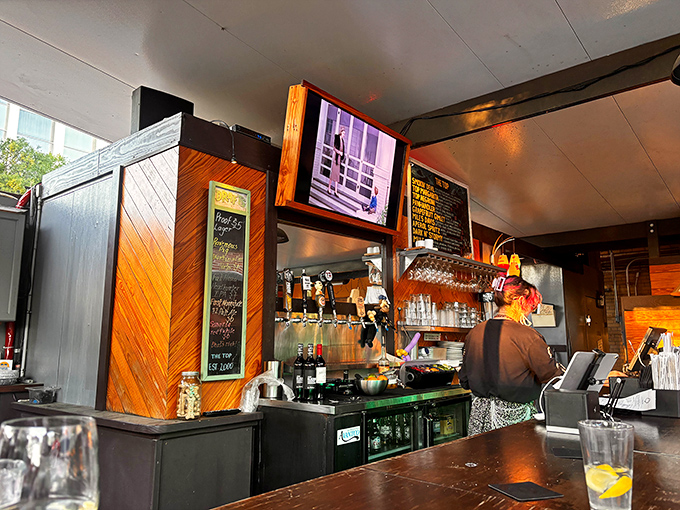 Behind the counter, where the magic happens &ndash; wood paneling and efficient design create a workspace that's both functional and stylish.