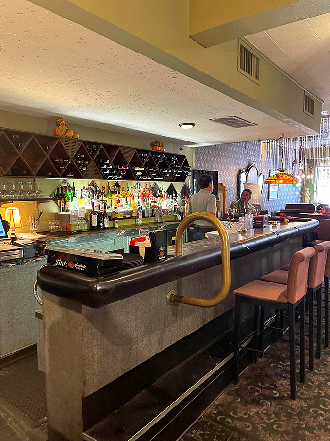 Pink bar stools invite you to sidle up for an aperitivo &ndash; the perfect prelude to the Italian feast that awaits.