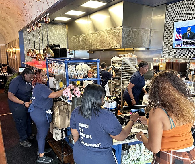 Behind the scenes magic where breakfast dreams become plate realities. Those blue uniforms should come with superhero capes.