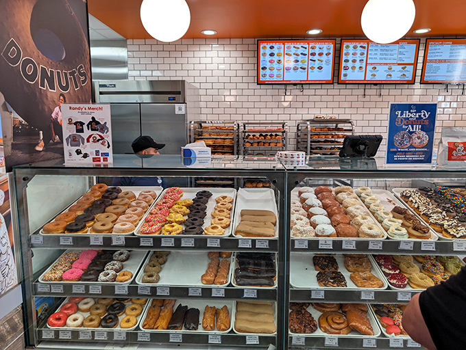The display case: a museum of fried dough masterpieces where it's perfectly acceptable to point and say "I'll take that one" repeatedly.